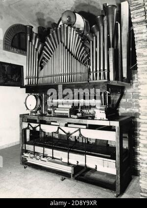 This barrel organ is a mechanical musical instrument that produces ...
