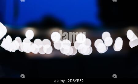A panoramic of light blur bokeh bulbs in the background of a lounge ...