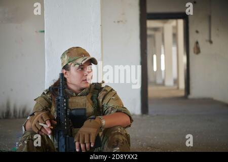 Military female soldier having a break Stock Photo - Alamy