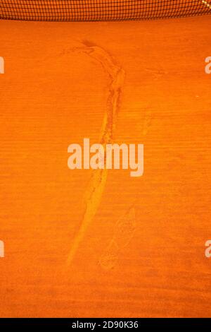 slide on the clay tennis court Stock Photo - Alamy