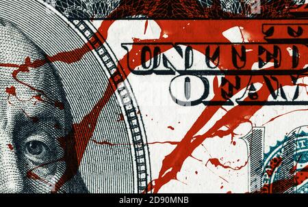 Blood money concept. Fragment of a one hundred dollar bill with blood ...