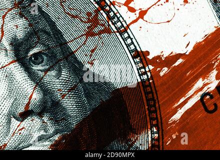 Blood money concept. Fragment of a one hundred dollar bill with blood ...