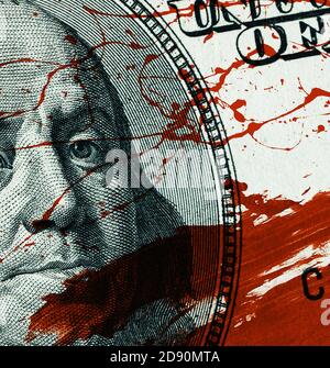 Blood money concept. Fragment of a one hundred dollar bill with blood ...