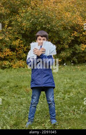 Girl throwing out medical mask Stock Photo - Alamy