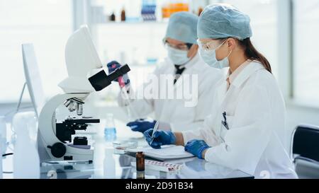 close up. scientists conduct research in a modern laboratory Stock ...