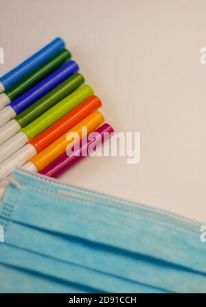 Color pencil and mask with light background Stock Photo - Alamy