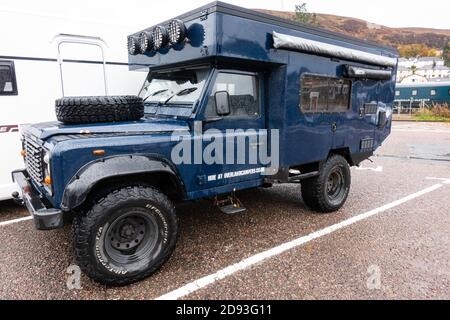 A Land Rover Defender converted into an overland expedition vehicle or ...
