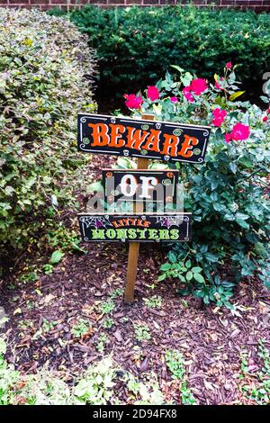Halloween lawn sign that says beware of monsters Stock Photo - Alamy