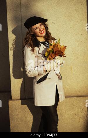 Hello september. smiling elegant woman in scarf with leather gloves ...