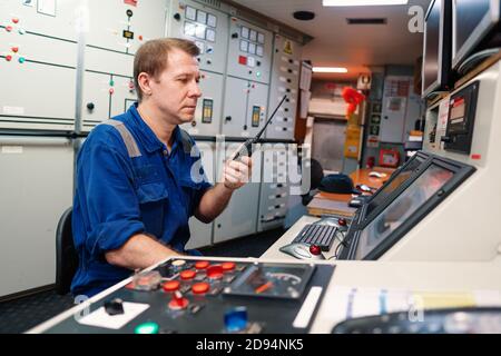 Marine engineer officer controlling vessel enginesand propulsion in ...