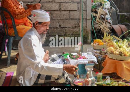 The Hindu Priest or widely known as Pedanda by the Balinese, blessing ...