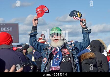 President Donald Trump cheers during an NFL football game between the ...