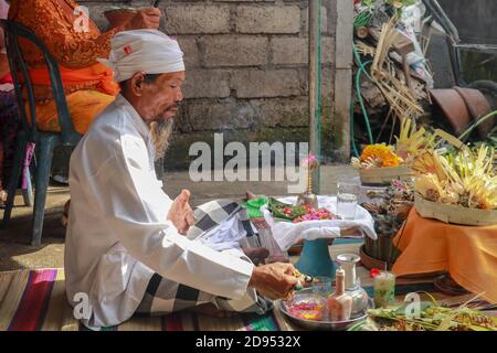 The Hindu Priest or widely known as Pedanda by the Balinese, blessing ...