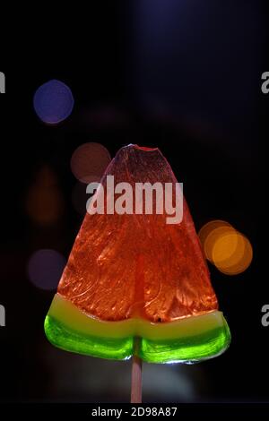 sweet slice, watermelon lollipop on a long stick in the form of a ...