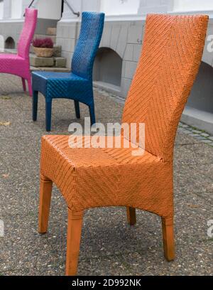 colored chairs with a large back outdoors in a pedestrian area Stock ...