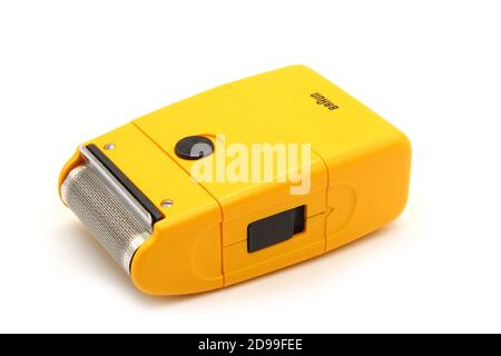 Vintage Braun yellow electric shaver, isolated on white background ...