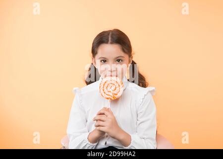 Malnutrition common problem. Girl pupil school uniform likes sweets ...