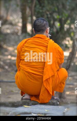Old buddhist monk smoking cigarette in his temple in Kathmandu Stock ...
