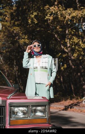 Stylish and elegant woman in a car salon Stock Photo - Alamy