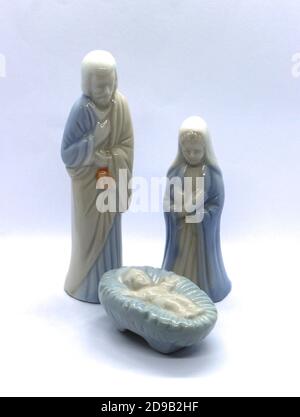 Porcelain nativity scene in pale blue and cream colours against a white ...