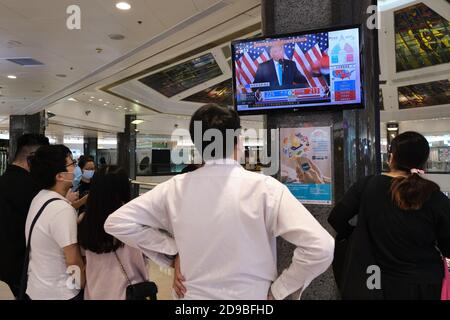 People watch a live broadcast at a shopping mall of the World Cup Group ...