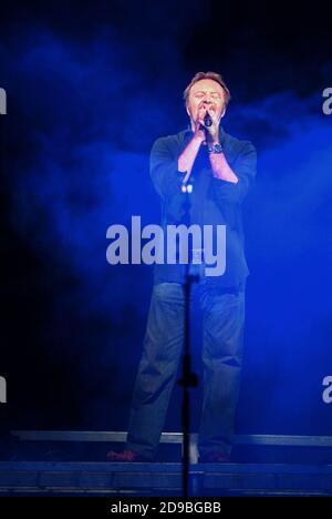 The Italian singer-songwriter Umberto Tozzi posing leant on a carriage ...