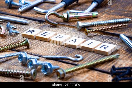 Repair word on wooden background. Collage of tools Stock Photo - Alamy