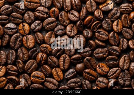Roasted coffee beans top view, closeup image, space for text Stock ...