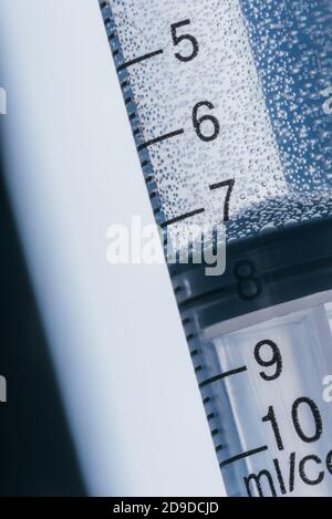 Medical syringe with blood, ampule and pills on yellow background Stock ...