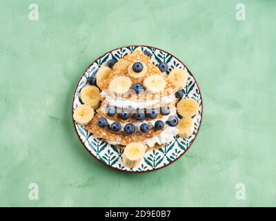 Christmas tree shaped sweet crepe with blueberries Stock Photo - Alamy