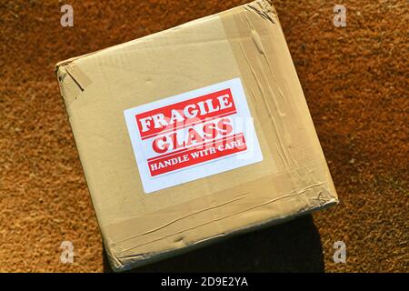 fragile glass warning label on parcel Stock Photo - Alamy
