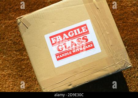 fragile glass warning label on parcel Stock Photo - Alamy