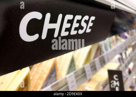 Cheese signage at the fresh chiller refrigerated section of supermarket ...