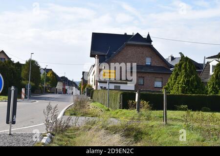Curve asphalt road along the small pond to the countryside farm in ...