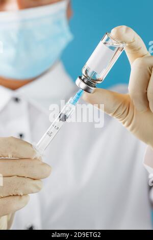 Nurse takes an ampoule of medicine from the manipulation table Stock ...