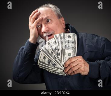 Happy, portrait of a man with money fan and in a blue background for ...