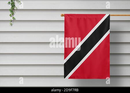 Small national flag of the Trinidad and Tobago on a black background ...