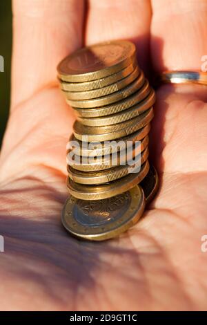 round metal coins of Golden color, legal tender that is used for ...