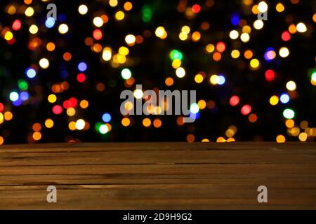 Empty wooden table against blurred room with Christmas tree, bokeh ...