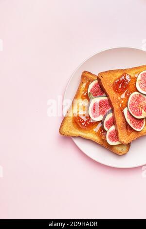 Tasty sandwiches with fig on color background Stock Photo - Alamy