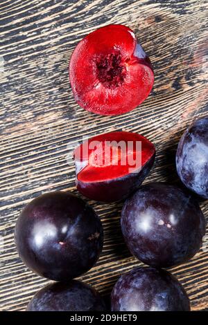 red homemade plums during cooking, delicious and healthy sliced plums ...