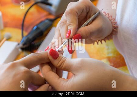 Woman getting nails done in nail salon Stock Photo - Alamy