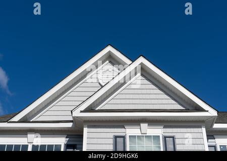 Double gable roof with attic vent or window Stock Photo - Alamy