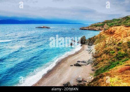HDR image of a secluded beach on Skiathos island on a cloudy day Stock ...