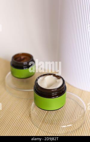 Opened glass cream pot with copy space for your brand isolated on ...