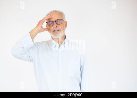 Middle age hoary senior man wearing glasses over isolated background ...