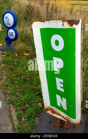 rotating open sign in a field Stock Photo - Alamy