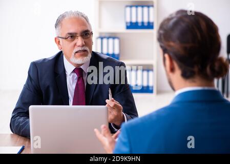 Male candidate employee meeting with old recruiter Stock Photo - Alamy