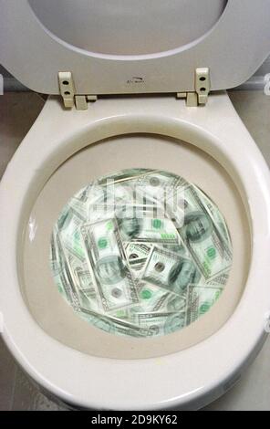 Money down the toilet Stock Photo - Alamy