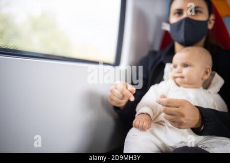 Toddler looking through legs Stock Photo - Alamy
